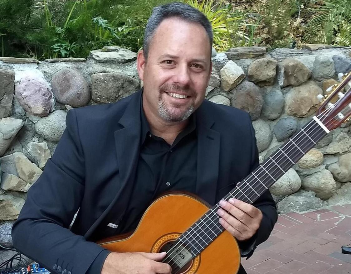 Orange Musician David Adele - Solo Classical Guitarist | GigTown